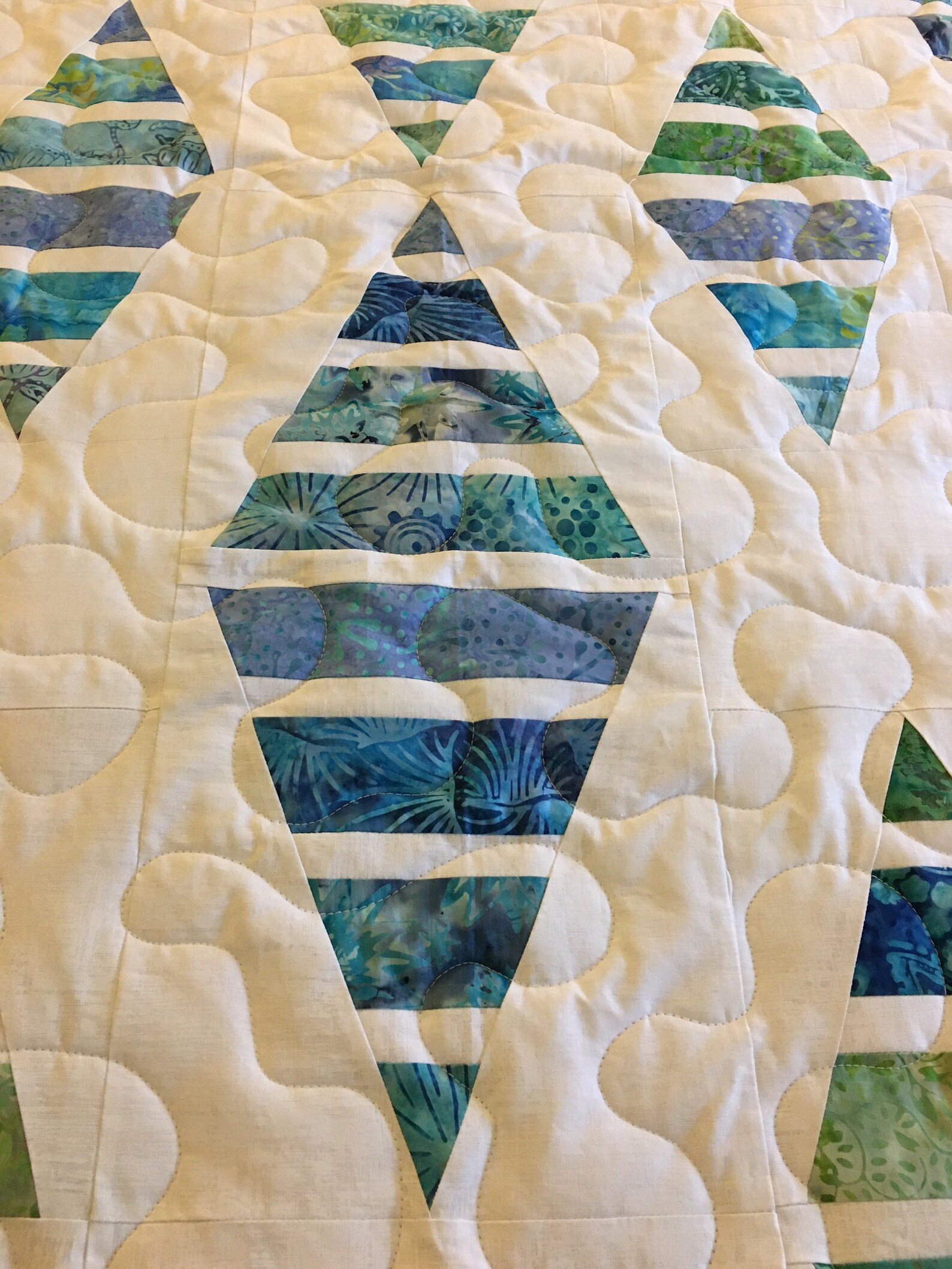 Multi colored batiks fabrics are blended with white to finish | Etsy