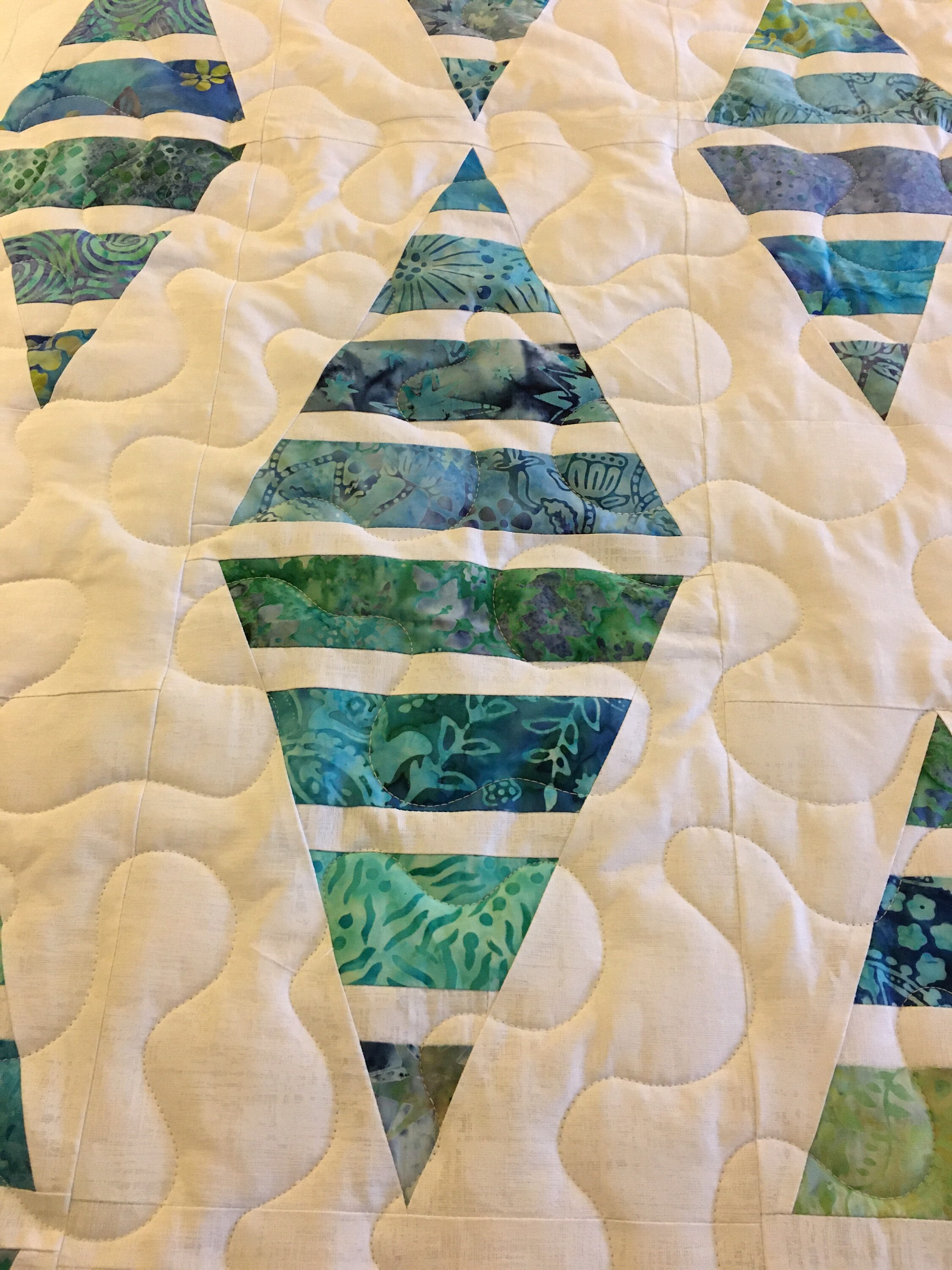 Multi colored batiks fabrics are blended with white to finish | Etsy