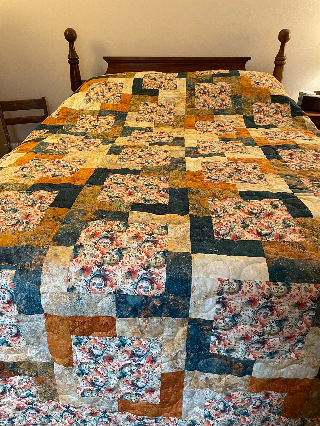 Multi Colored Quilt With an Assortment of Coordinated Blocks ...