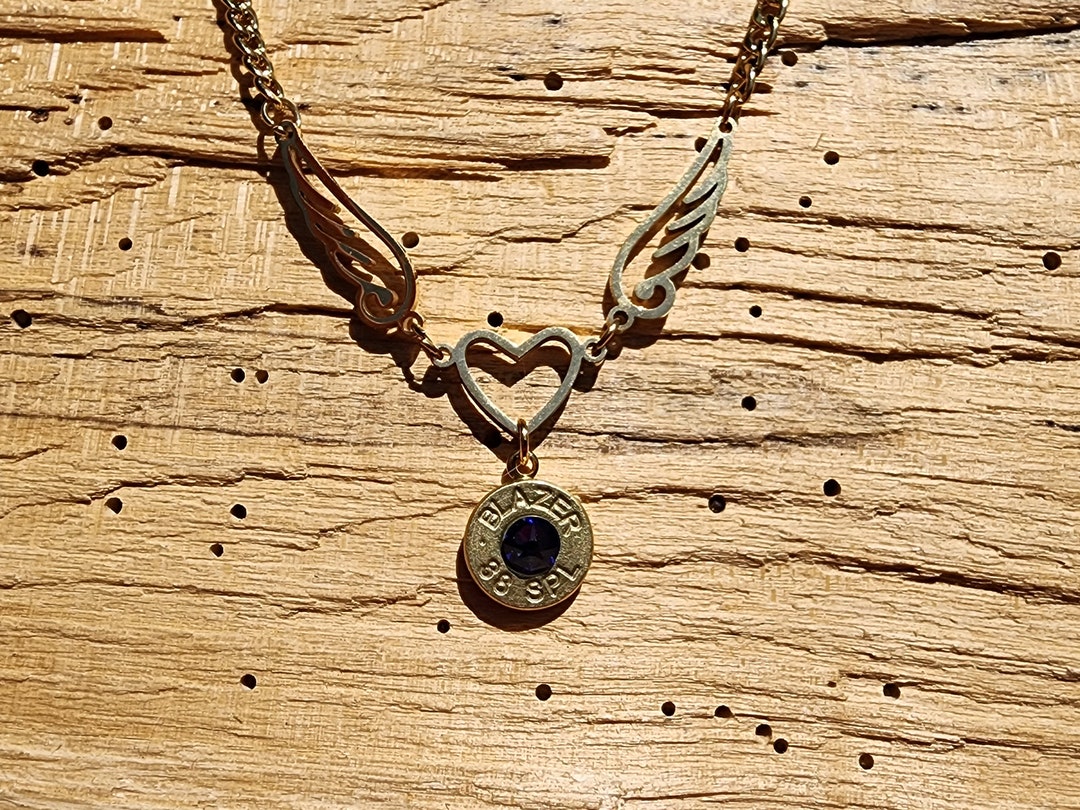 Gold Stainless Steel Heart and Wing Necklace With a Dangle Bullet Charm ...