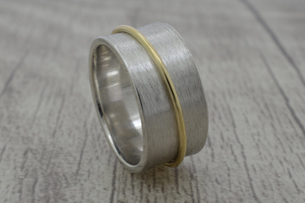 Silver turning ring with 333 gold hoop | Etsy
