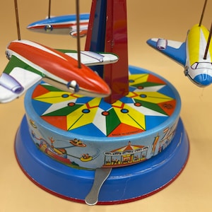 Vintage German Tin Toy 1990s Spinning Ride Tin Litho Carnival Rocket ...