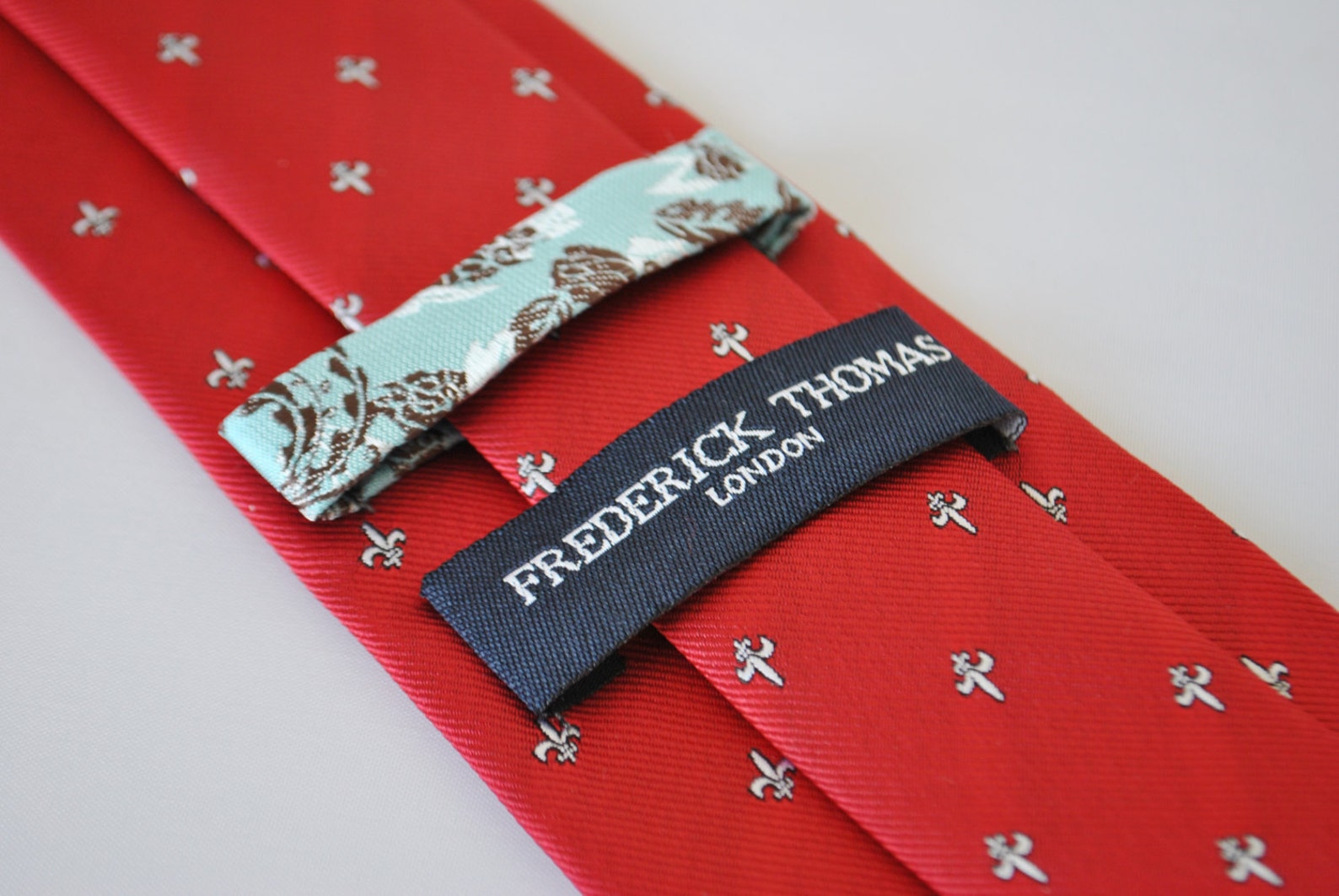 Red Tie With Fleur De Lis Design With Signature Floral Design to Rear ...
