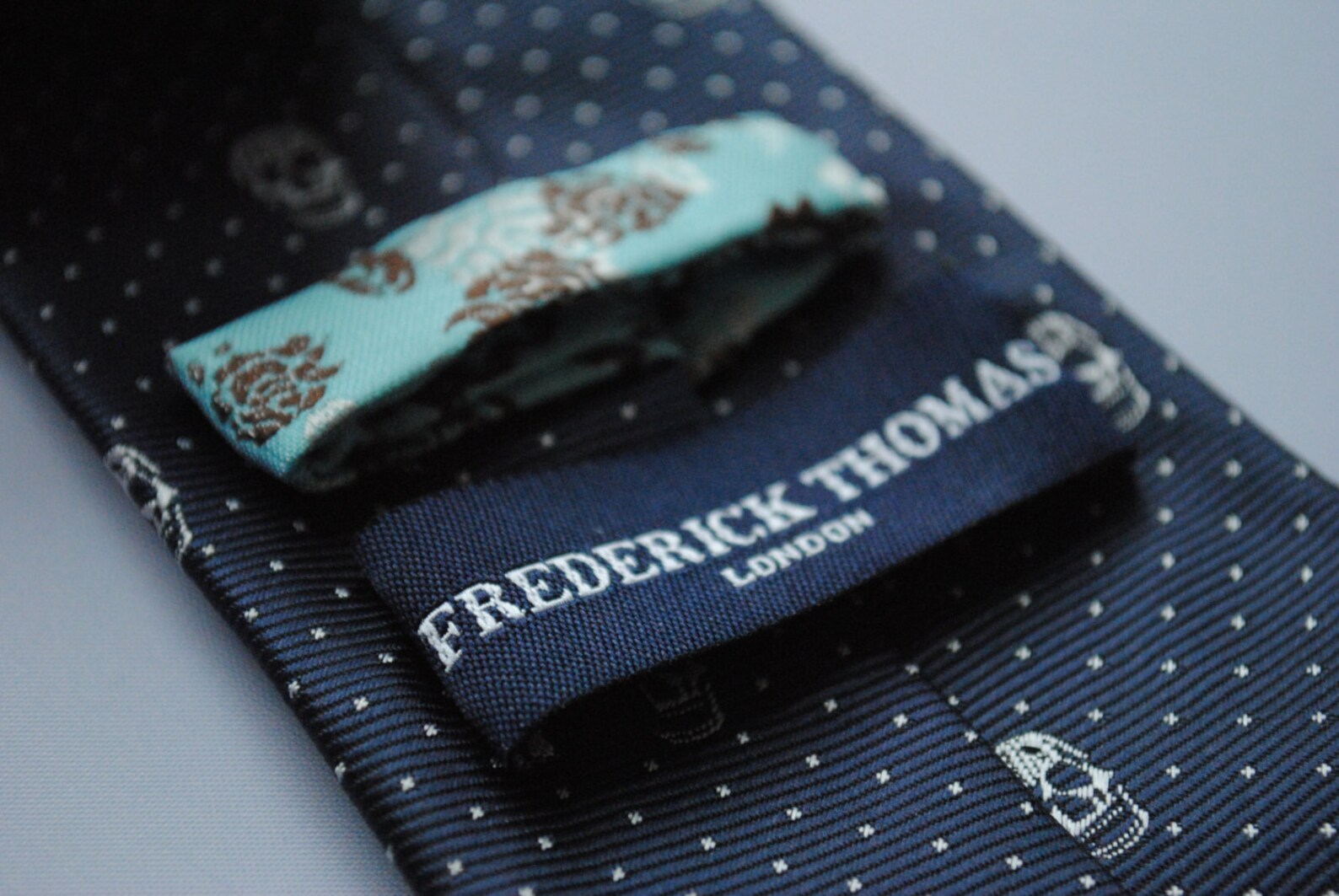 Navy Skulls Design Tie With Signature Floral Design to Rear by ...
