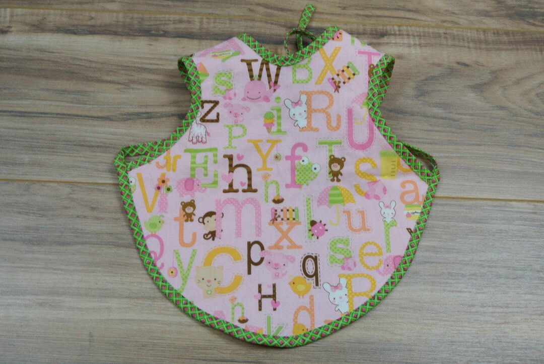 ABC Pink Alphabet Bapron Bib Apron. It is a Full Coverage Tie on Bib ...