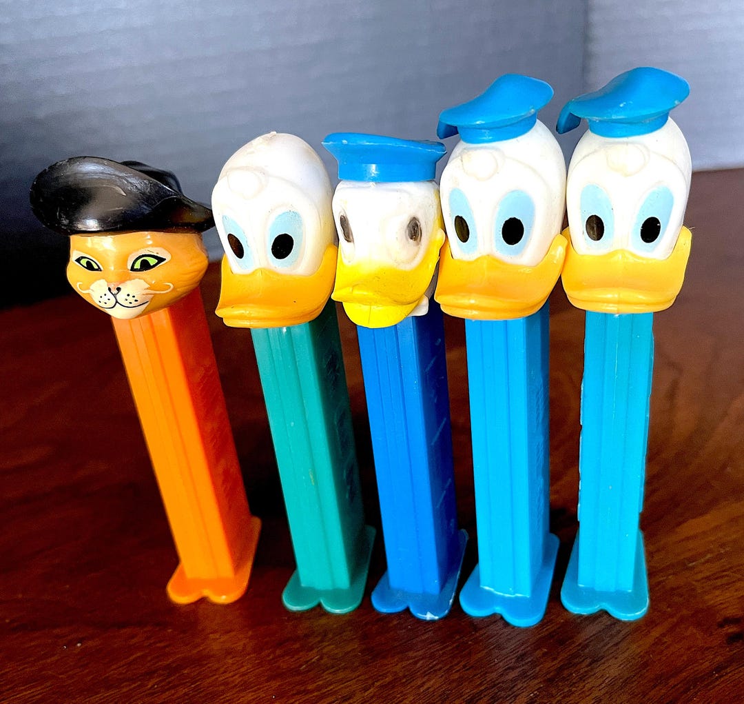 1980's Assorted PEZ Dispensers, 4 Donald Ducks N 1 Puss N Boots. Yellow ...