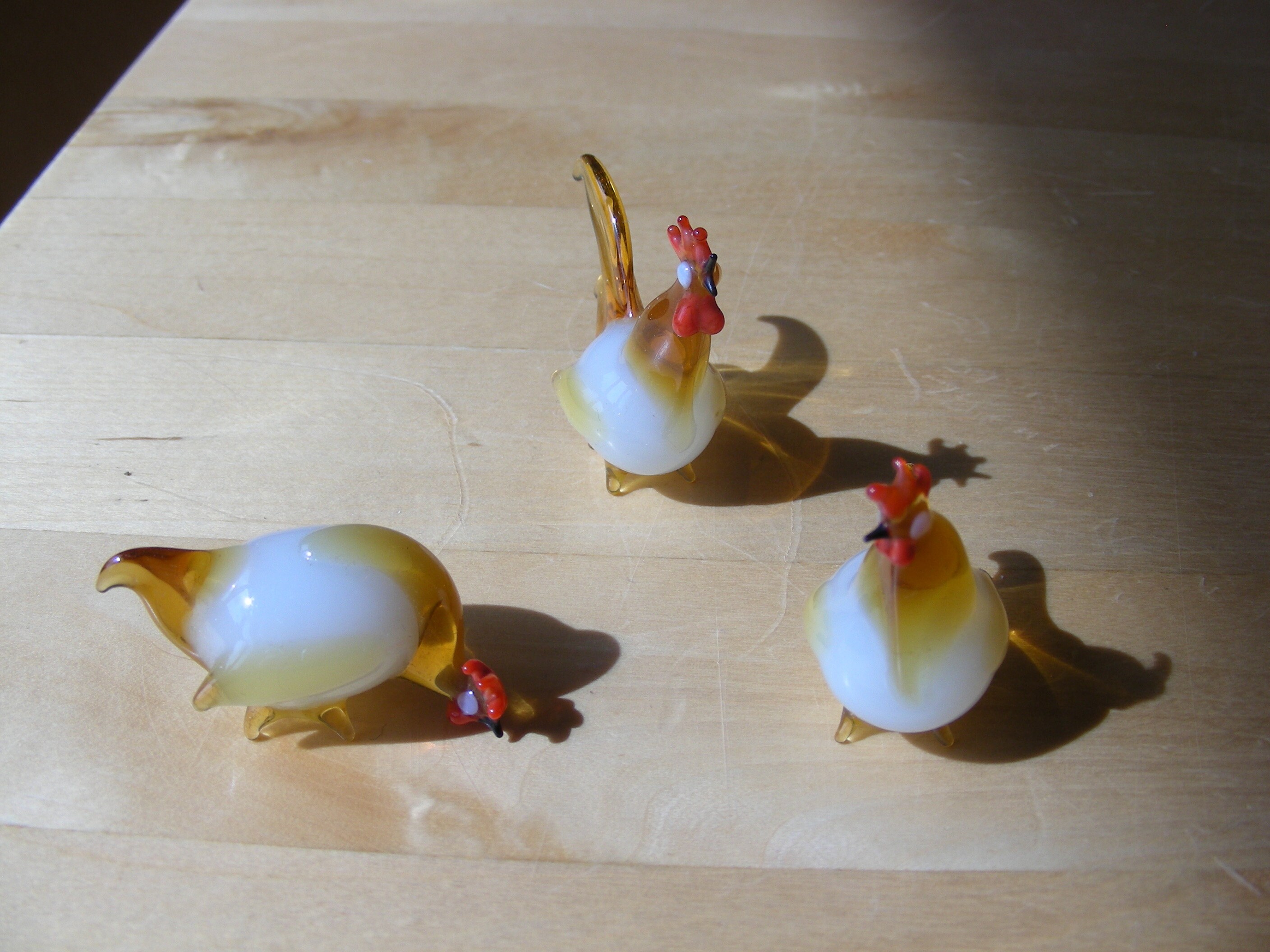 Vintage miniature glass chickens, most likely Murano