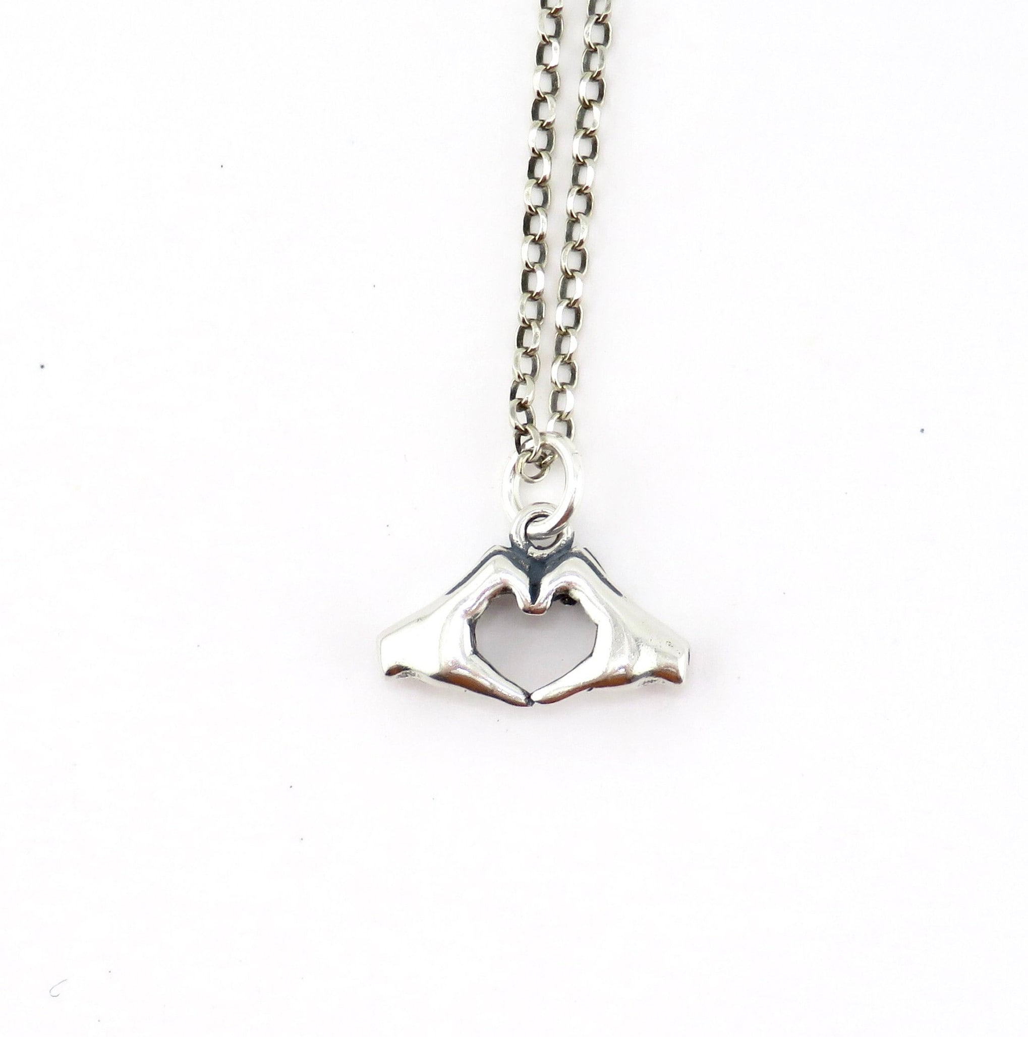 Hand heart necklace store