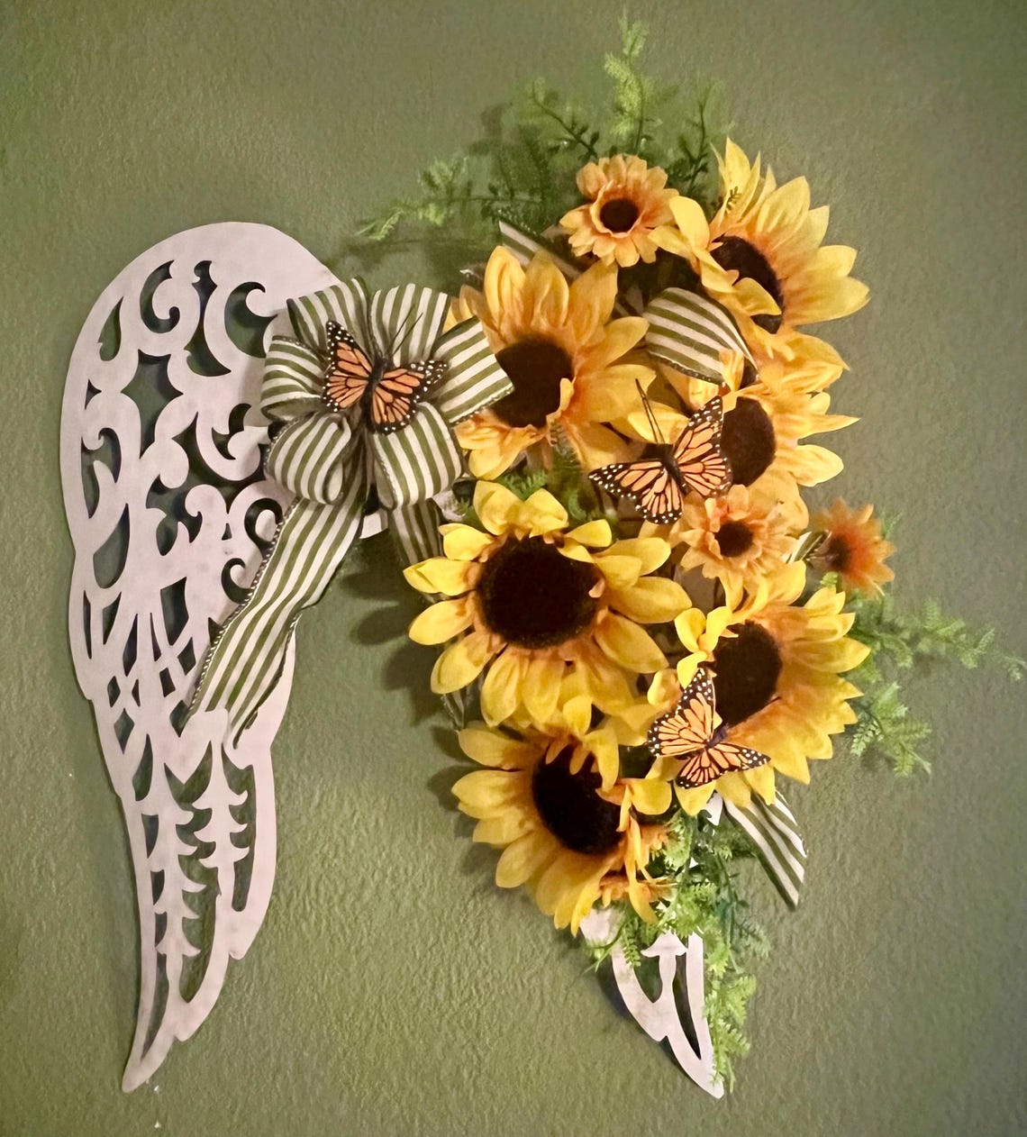 Metal Angel Wings With Side Floral Arrangement. Flowers Cover One Side ...