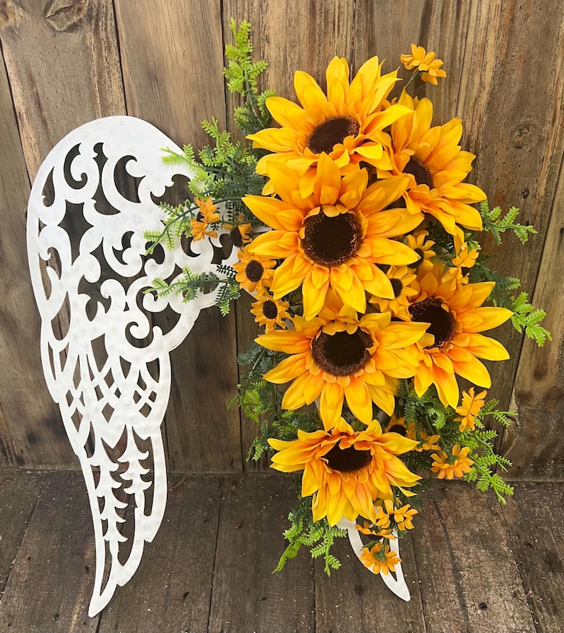 Metal Angel Wings With Side Floral Arrangement. Flowers Cover One Side ...