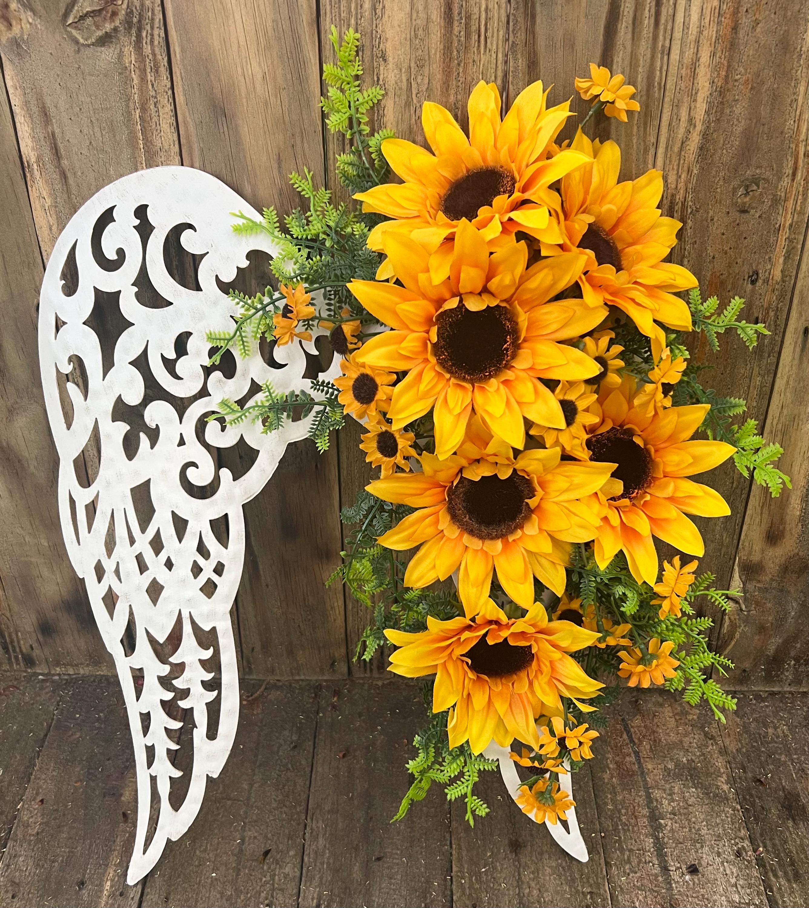 Metal Angel Wings With Side Floral Arrangement. Flowers Cover One Side ...