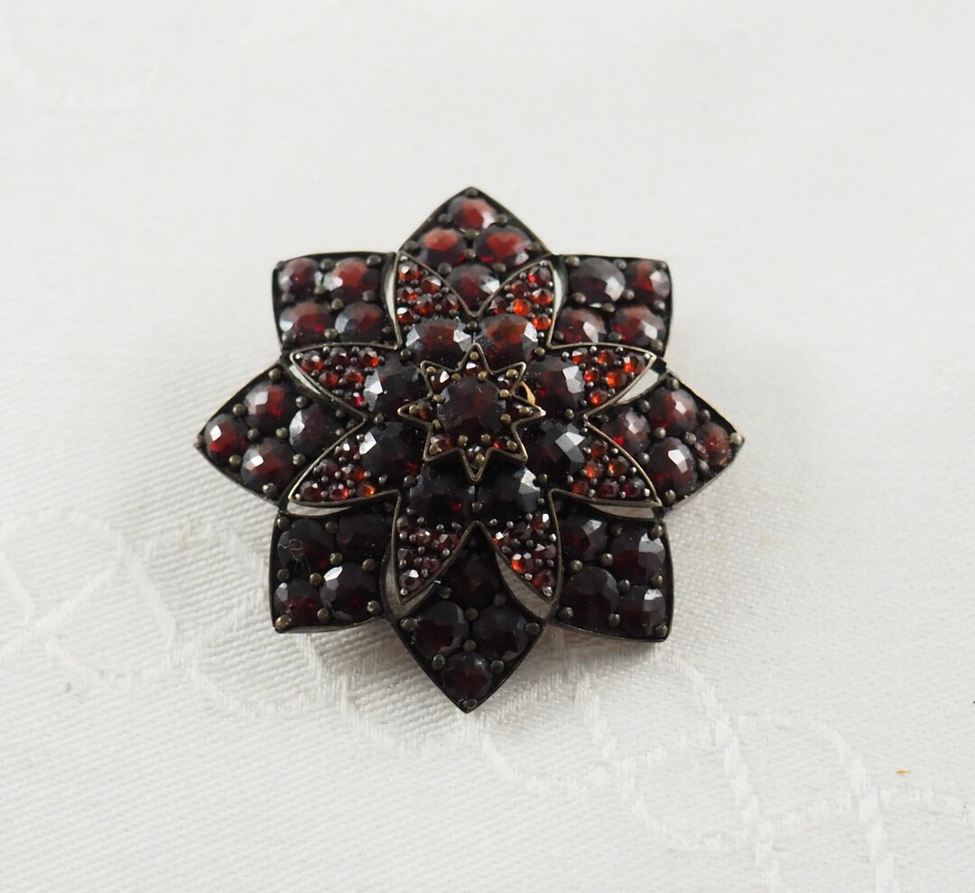 Antique Victorian Bohemian Garnet Star Brooch in Pinchbeck or Tombak, Large and Small Rose Cut ...
