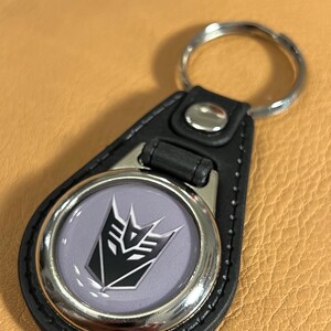 TRANSFORMER KEYCHAIN GREY - Etsy