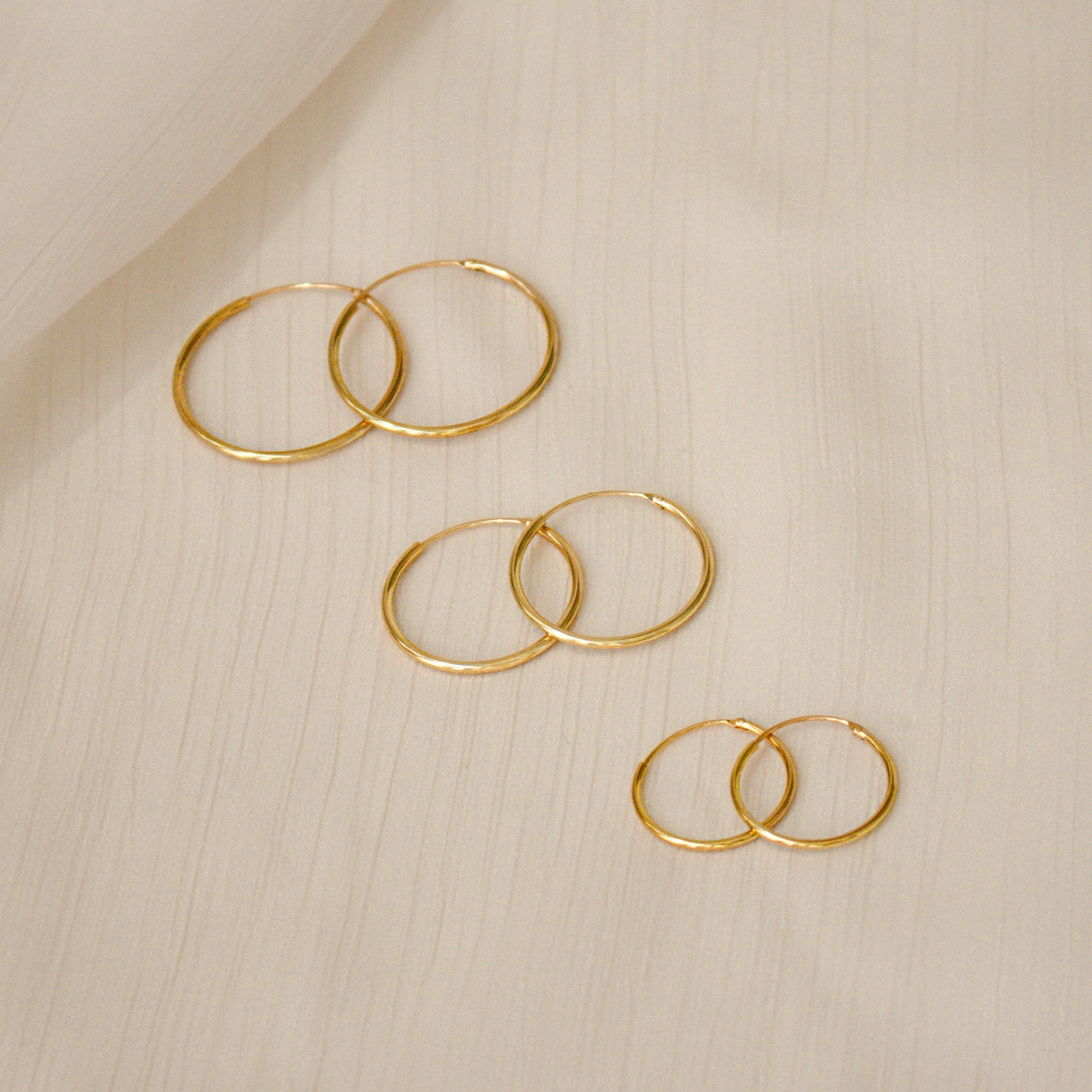 Medium Thin Hoop Earrings in Gold by Caitlyn Minimalist - Etsy