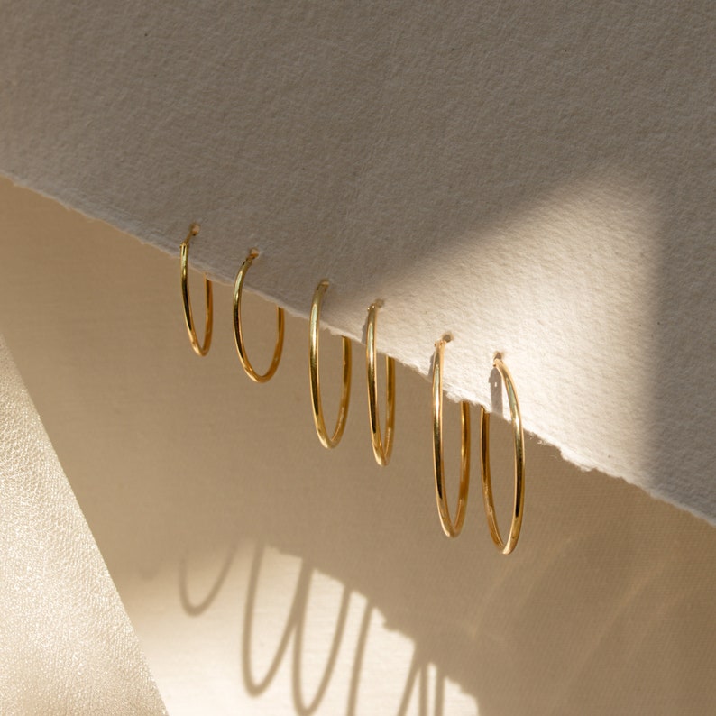 Medium Thin Hoop Earrings in Gold by Caitlyn Minimalist - Etsy