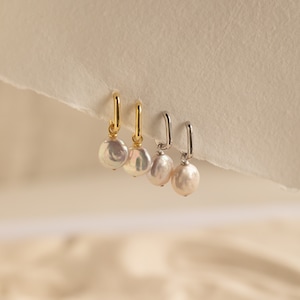 Dangling Pearl Huggie Hoops by Caitlyn Minimalist • Dainty Hoop Earrings With Pearl Charm ...