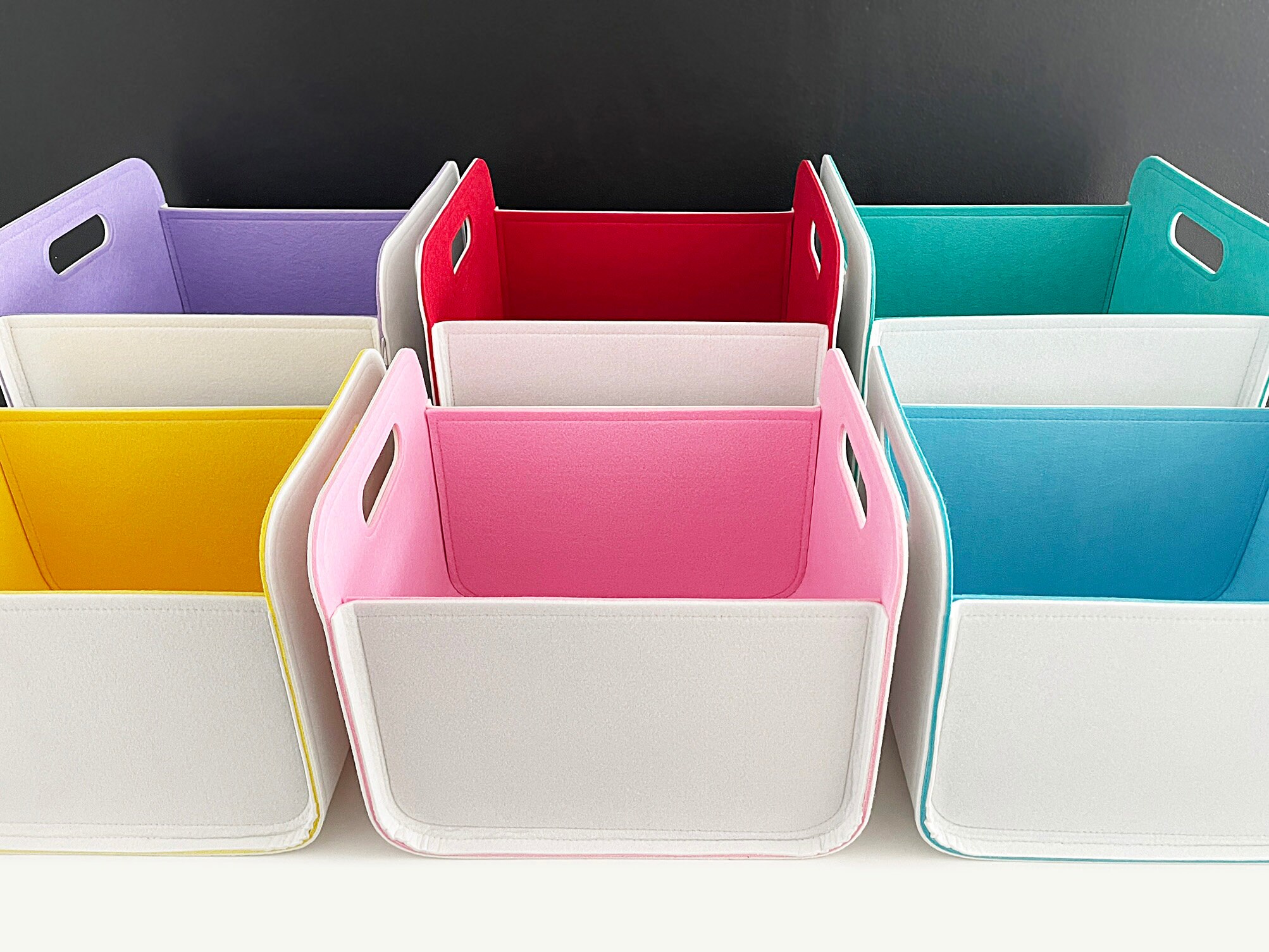 Colorful plastic storage bins store