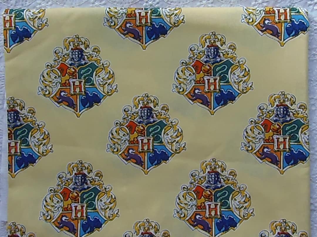 Harry Potter Hogwarts House Crests on Yellow Designer Camelot Fabrics ...