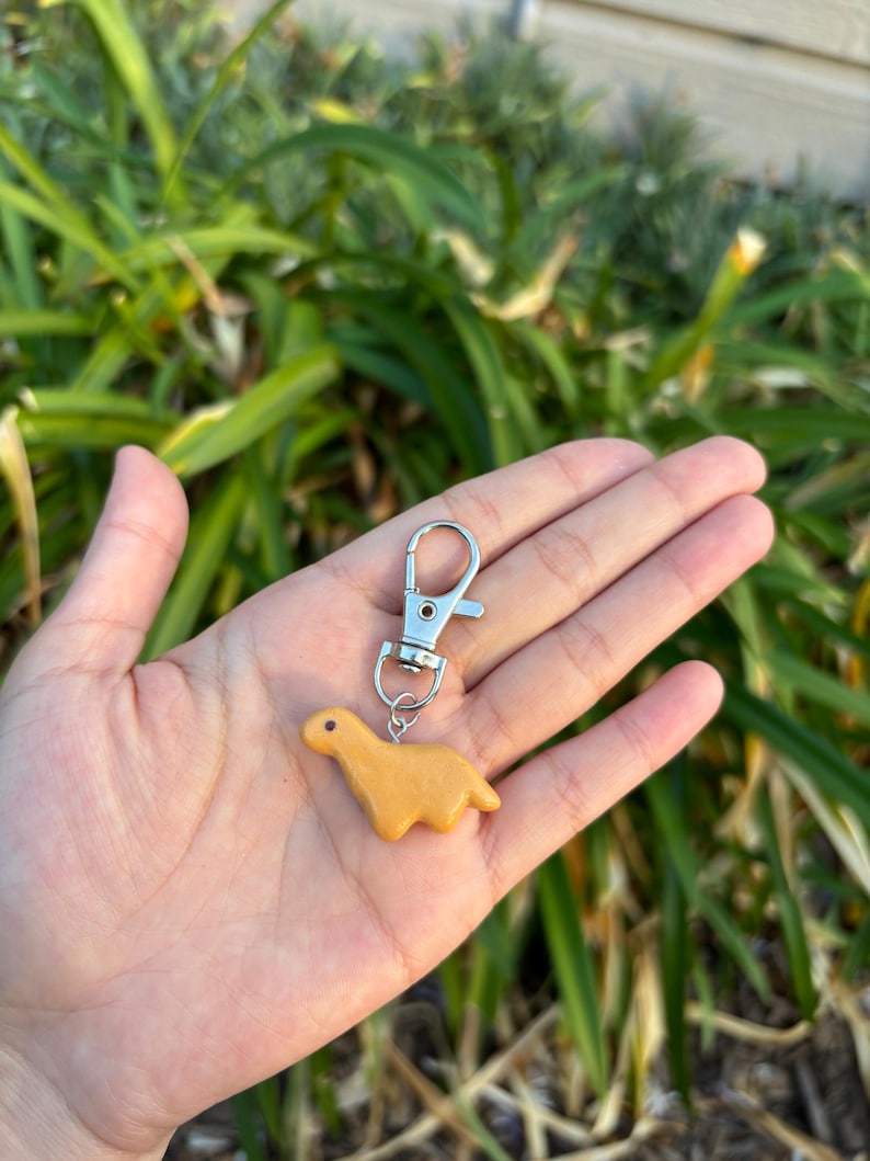 Dino Nuggie Keychain: Handmade Polymer Clay Dinosaur Bag Charm - Etsy