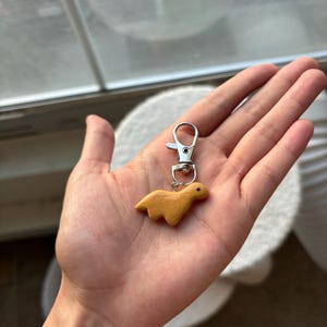 Dino Nuggie Keychain: Handmade Polymer Clay Dinosaur Bag Charm - Etsy
