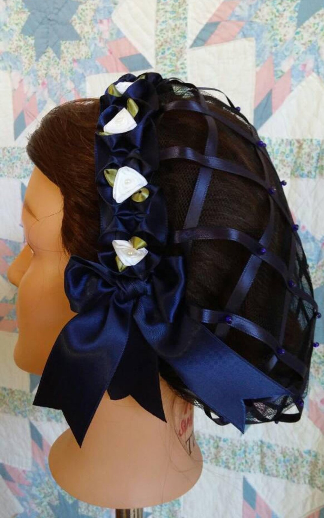 Navy Ribbon Hairnet With White Satin Ribbon Roses on a Navy Folded ...