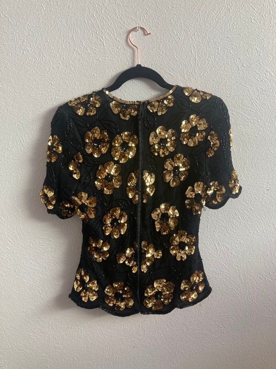 Small gold flower sequin design on black silk top - Gem