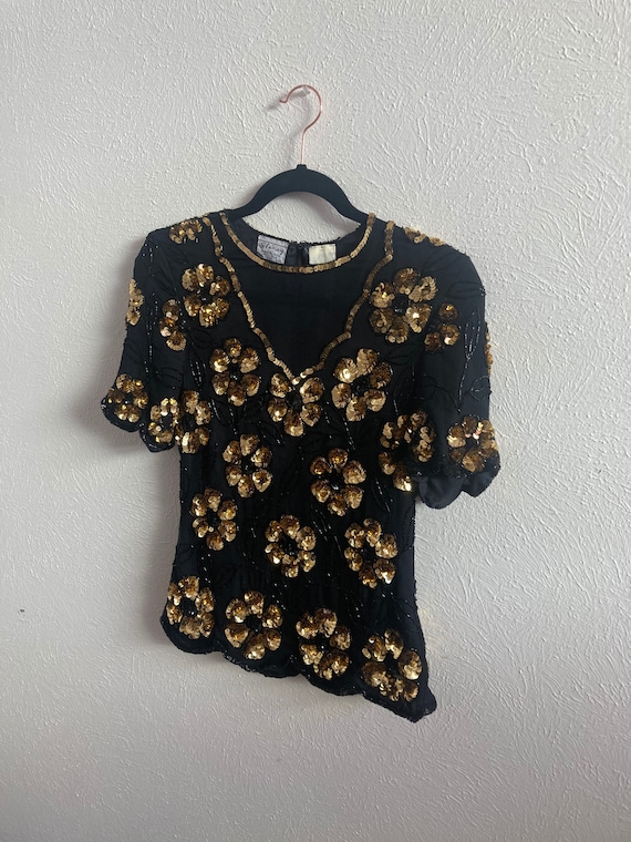 Small gold flower sequin design on black silk top - Gem