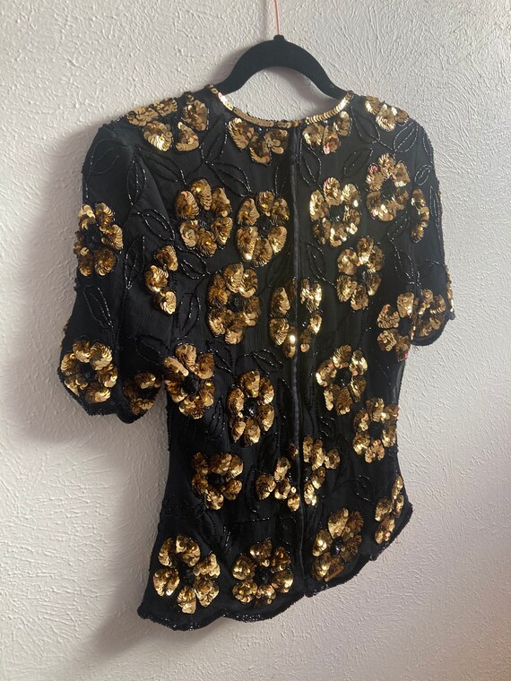 Small gold flower sequin design on black silk top - Gem
