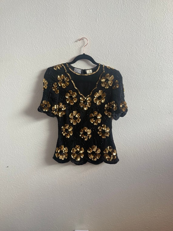 Small gold flower sequin design on black silk top - Gem