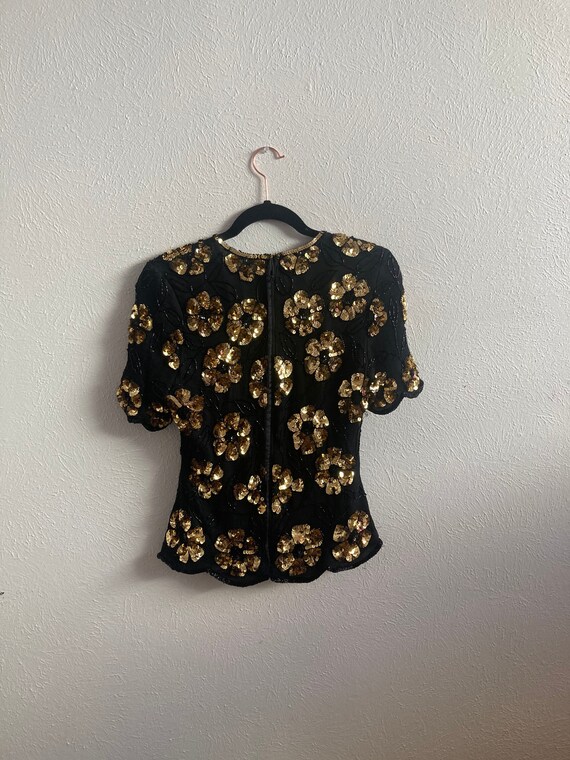 Small gold flower sequin design on black silk top - Gem