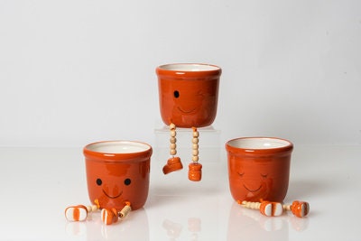 Winking Face Pot ~ Orange Sitter Pot With Dangling Legs ~ A Super Cute ...