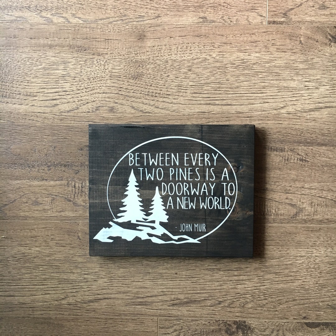 Between Every Two Pines is a Doorway to a New World Wood Sign, John ...