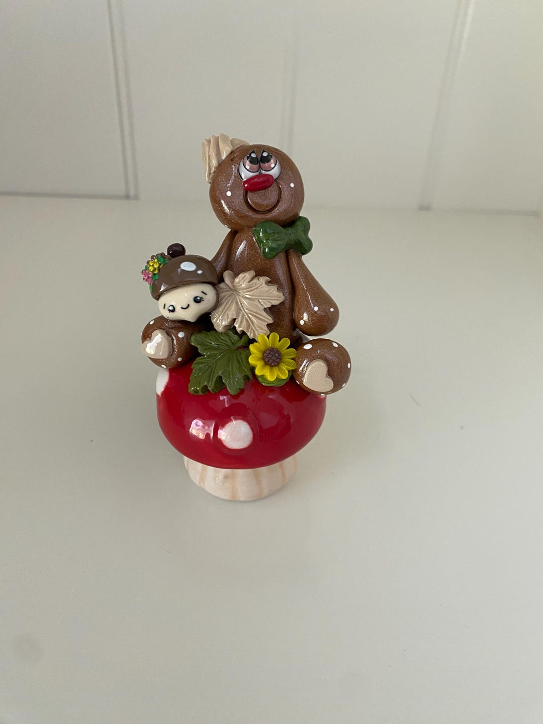 Polymer Clay Gingerbread Man Sitting on a Ceramic Mushroom With Fall ...