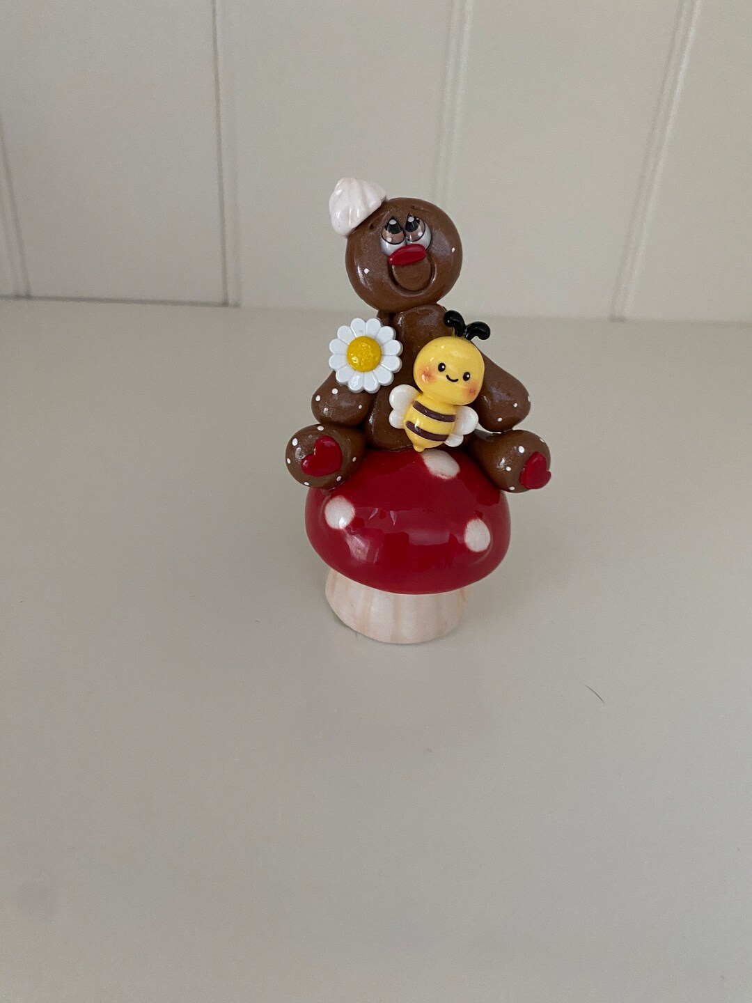 Polymer Clay Gingerbread Man Sitting on a Ceramic Mushroom With a Bee ...