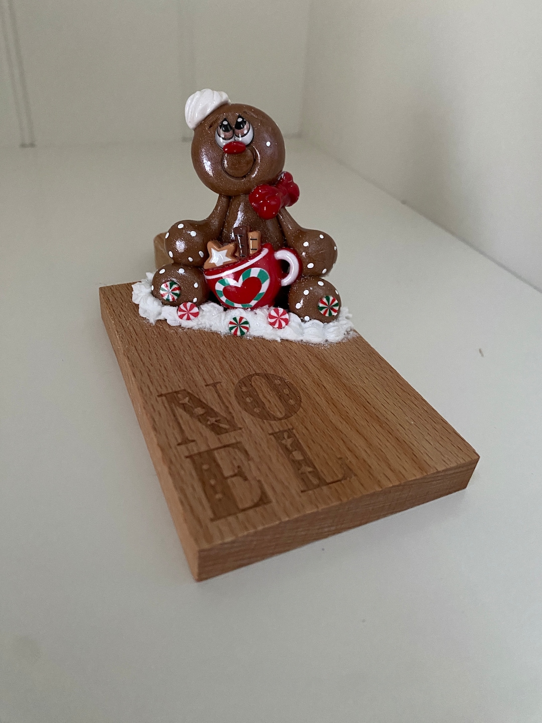 Polymer Clay Gingerbread Man Sitting on a Mini Cutting Board With a ...