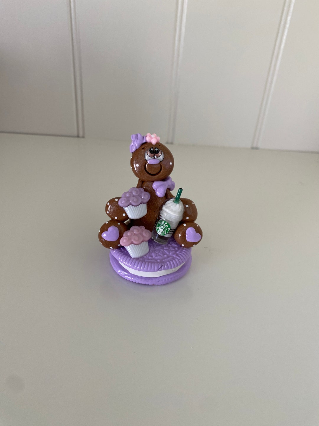 Polymer Clay Pastel Gingerbread Man Sitting on a Cookie With Cupcakes ...