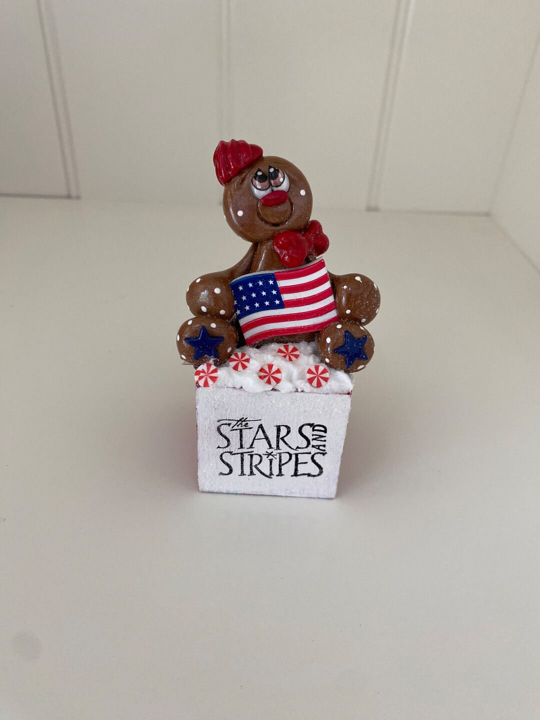 Polymer Clay Patriotic Gingerbread Man Sitting on a Stars and Stripes ...