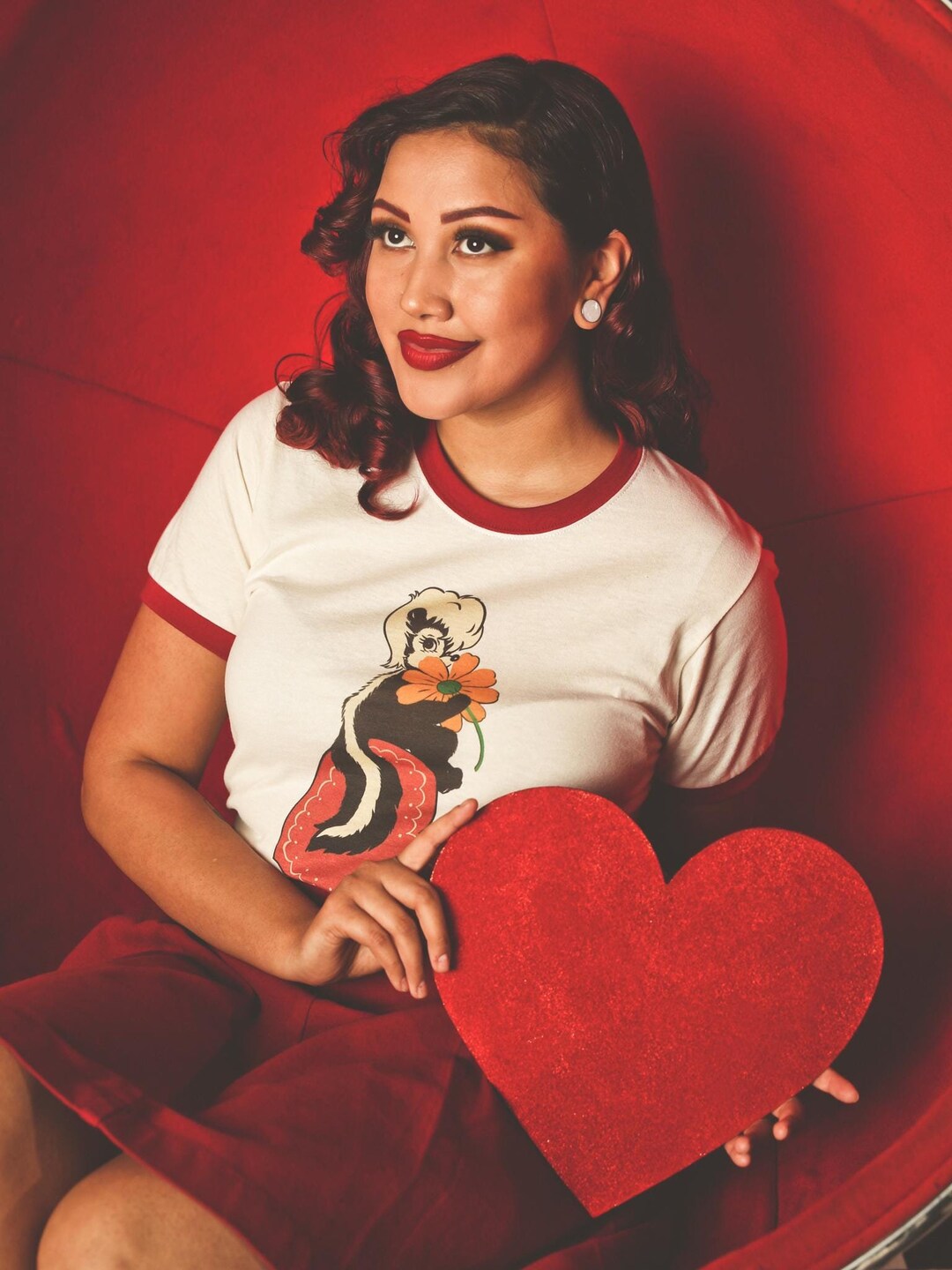 UNISEX Little Stinker Ringer Graphic T-shirt in Natural/rio Red ...