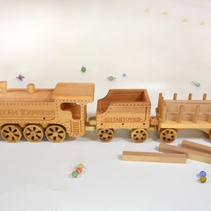 Wooden Toy Train Set / A Locomotive With a Tender and a Freight Car ...