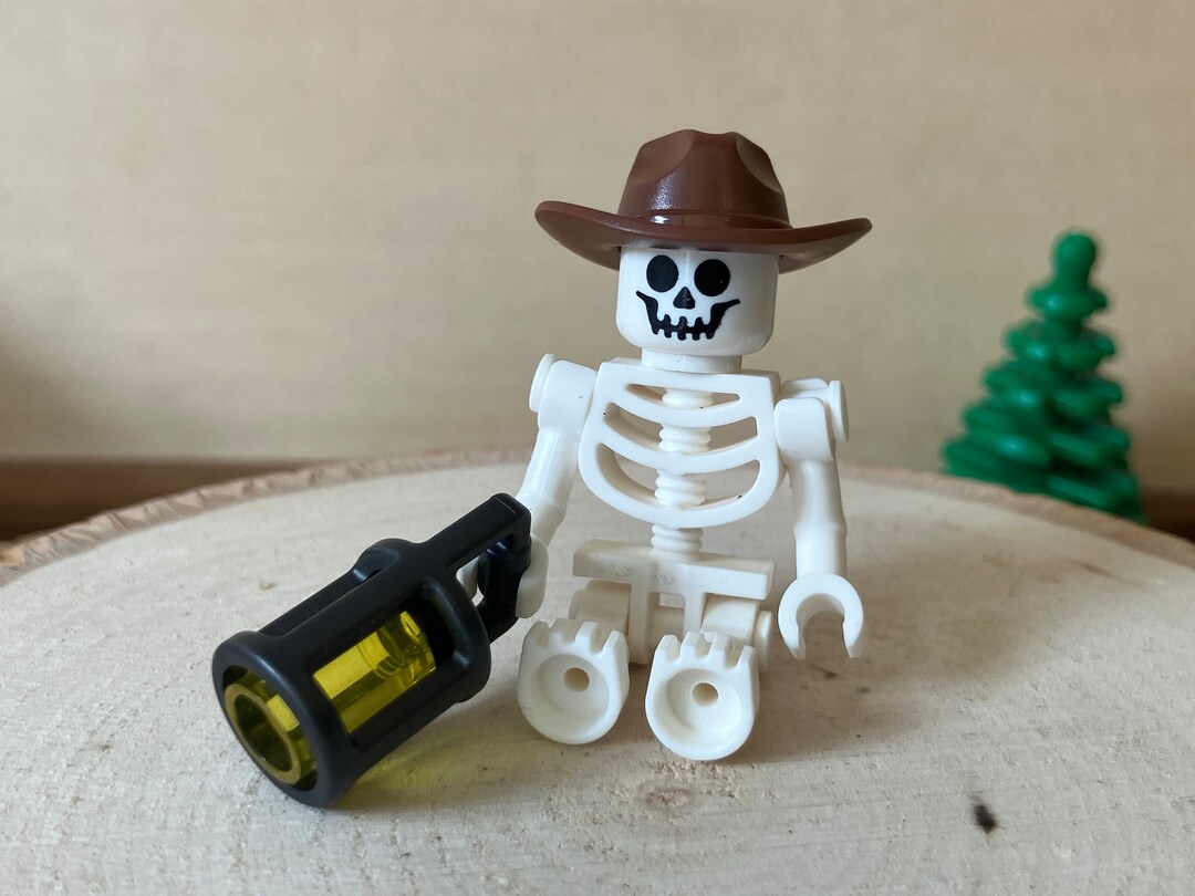 Skeleton Adventurer Wearing a Brown Fedora Hat Holding a Lit Lantern ...