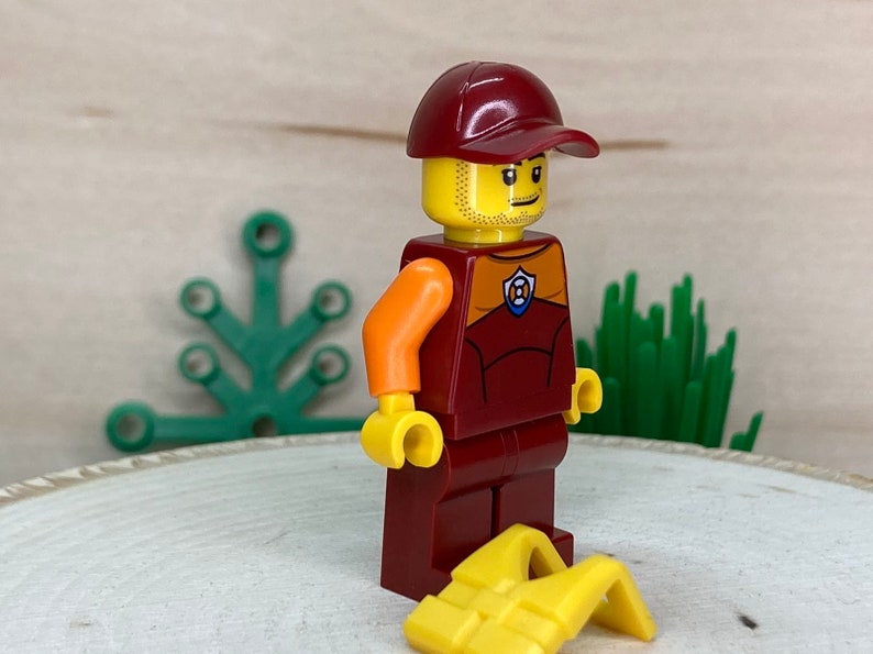 Lifeguard Wearing a Dark Red Cap and a Life Jacket – City: Coast Guard ...
