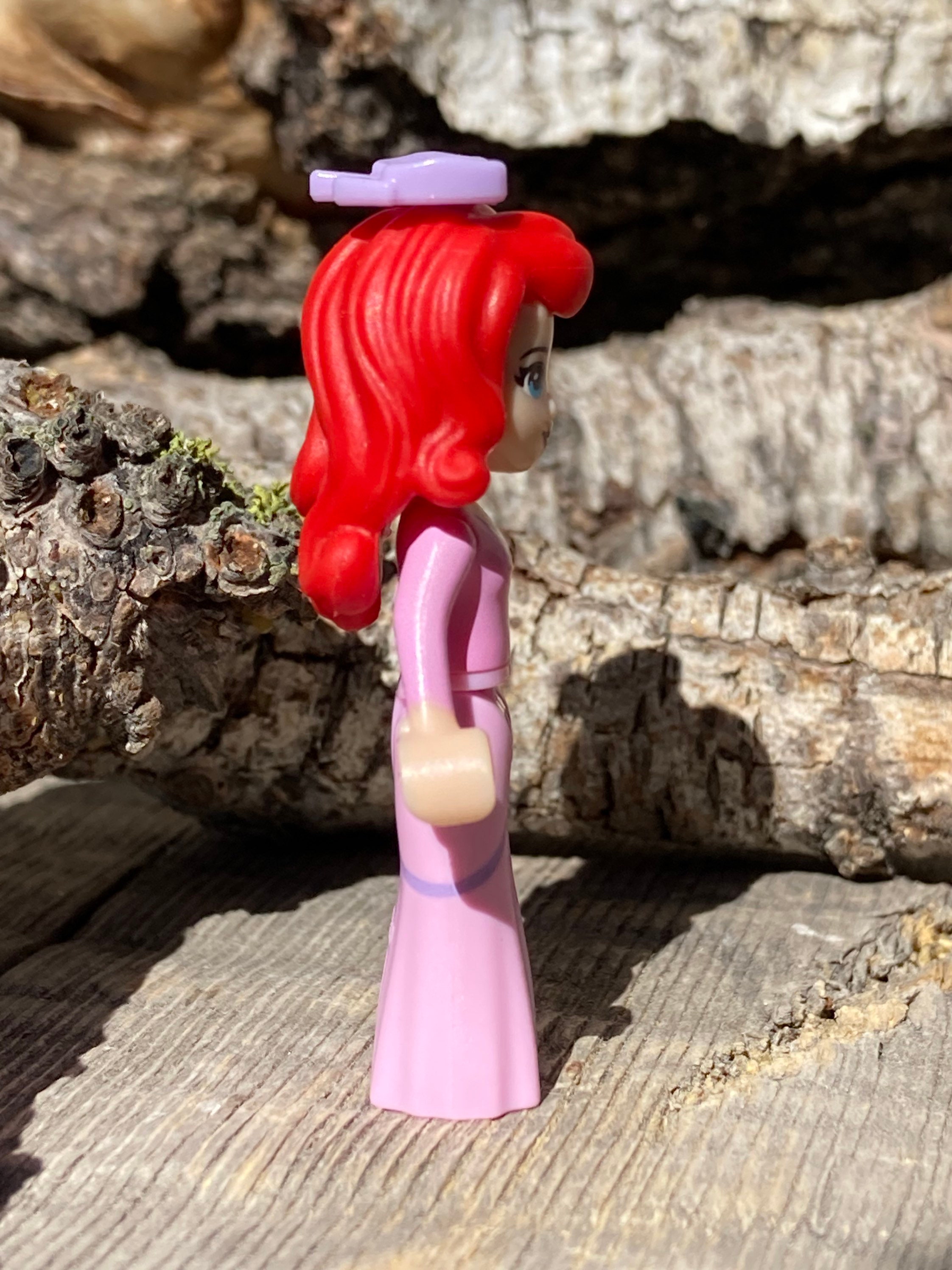 Ariel Wearing a Bright Pink Dress With White Stars With a Bow in Her ...