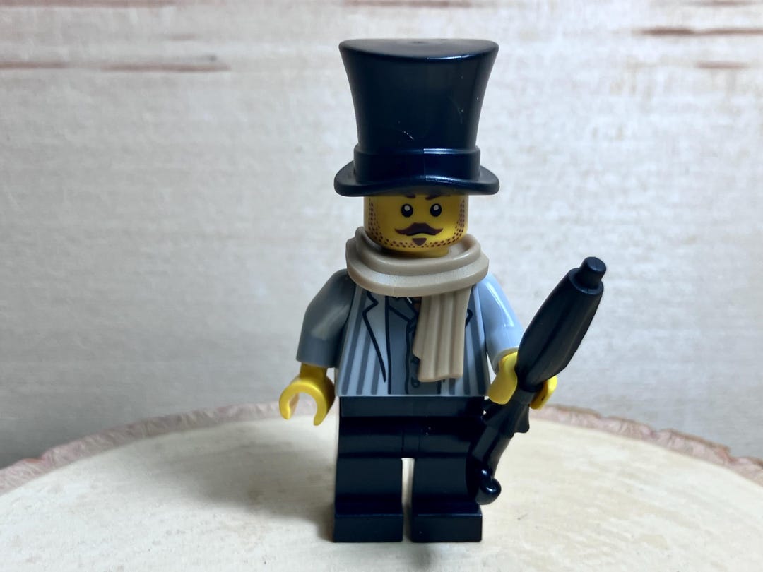 Distinguished Gentleman in Gray Suit With Dark Tan Scarf, Black Top Hat ...