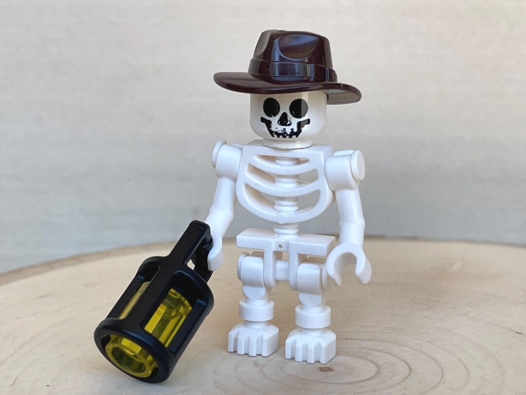 Skeleton Adventurer Wearing a Dark Brown Fedora Hat Holding a Lit ...