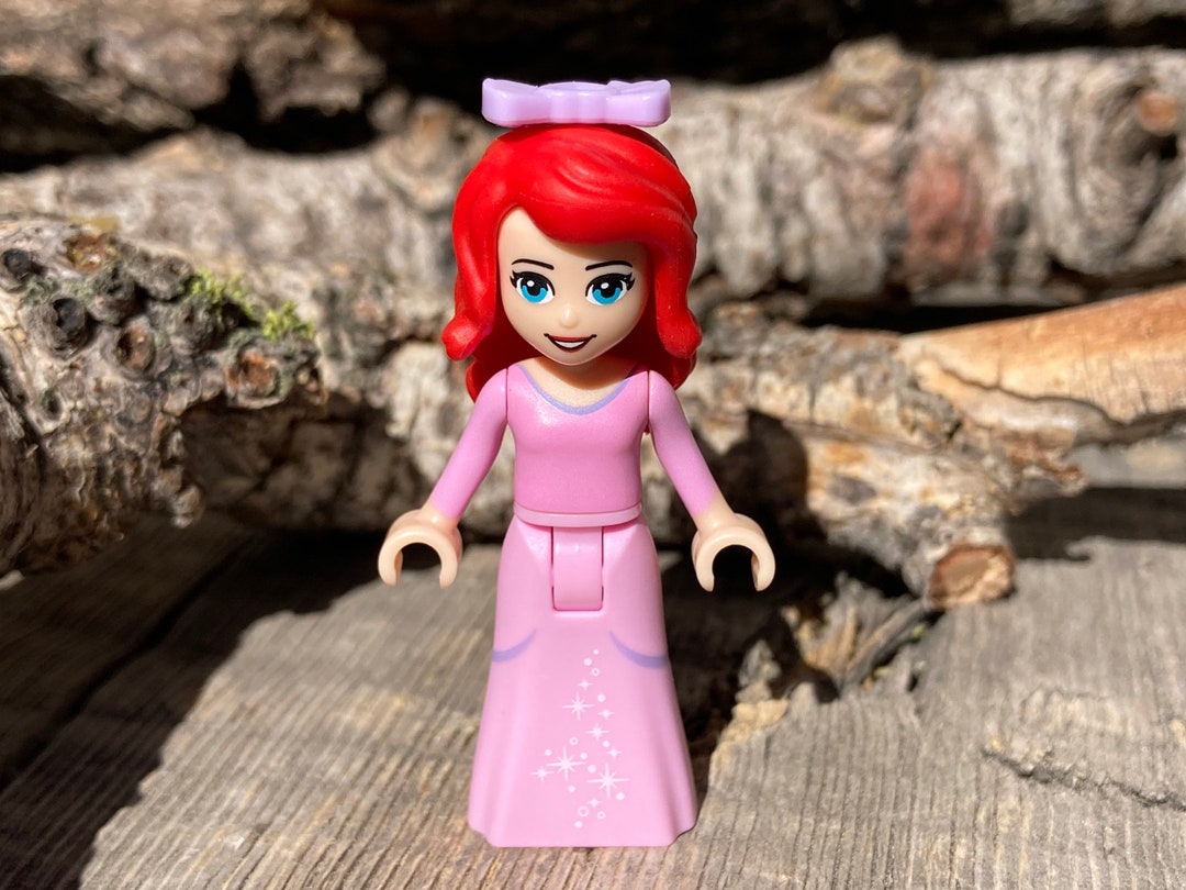 Ariel Wearing a Bright Pink Dress With White Stars With a Bow in Her ...