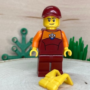 Lifeguard Wearing a Dark Red Cap and a Life Jacket – City: Coast Guard ...