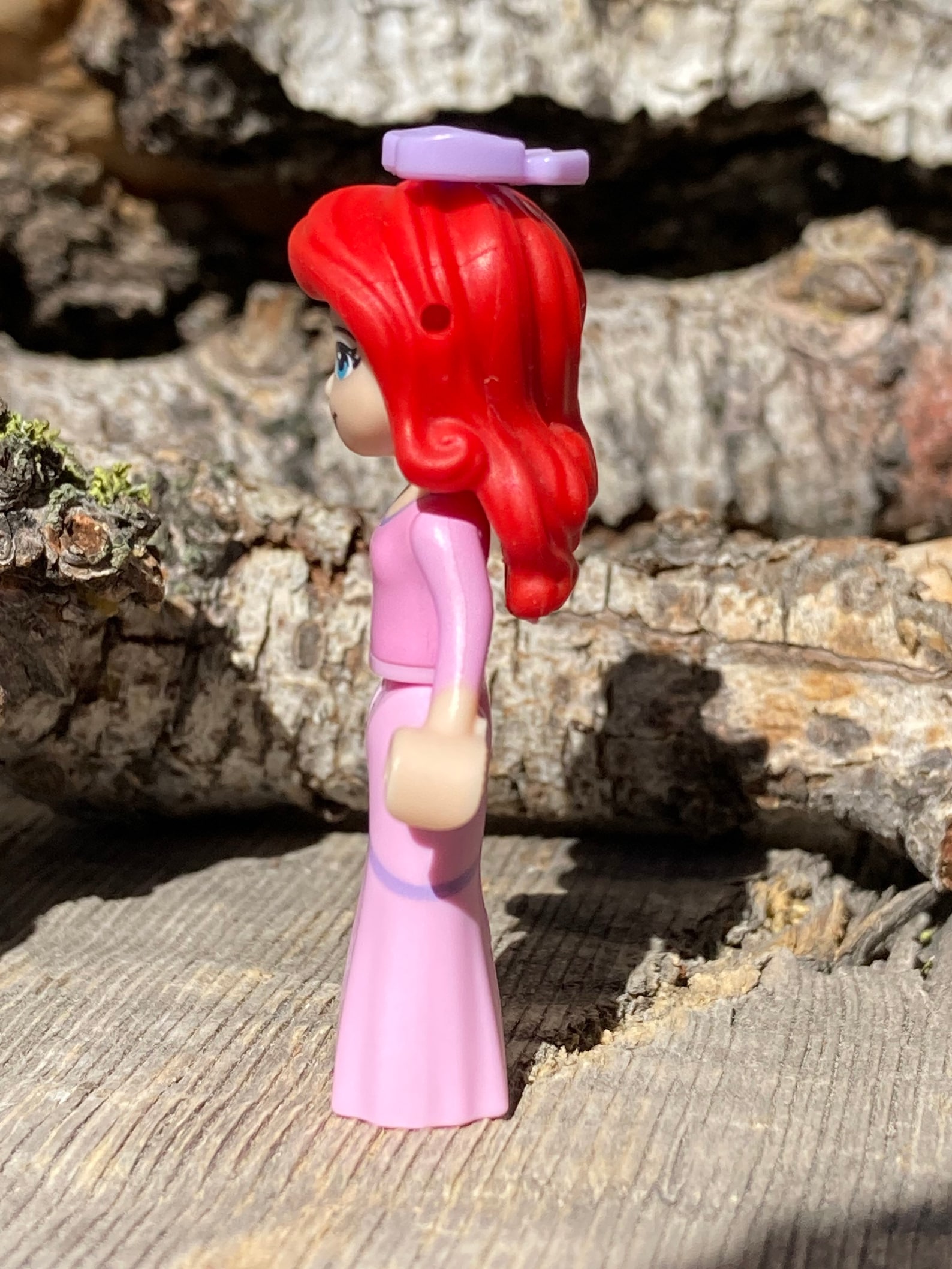Ariel Wearing a Bright Pink Dress With White Stars With a Bow in Her ...