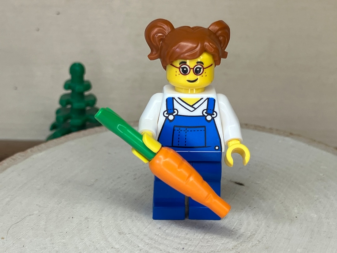 Lady Farmer Wearing Blue Overalls Holding an Orange Carrot City ...