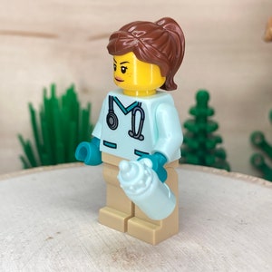 Female Veterinarian Wearing Light Aqua Scrubs, Tan Legs, Reddish Brown ...