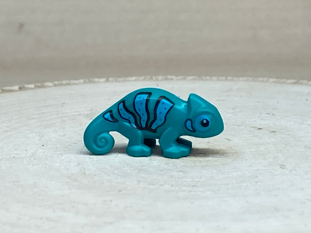 Dark Turquoise Chameleon With Black and Bright Light Blue Stripes ...